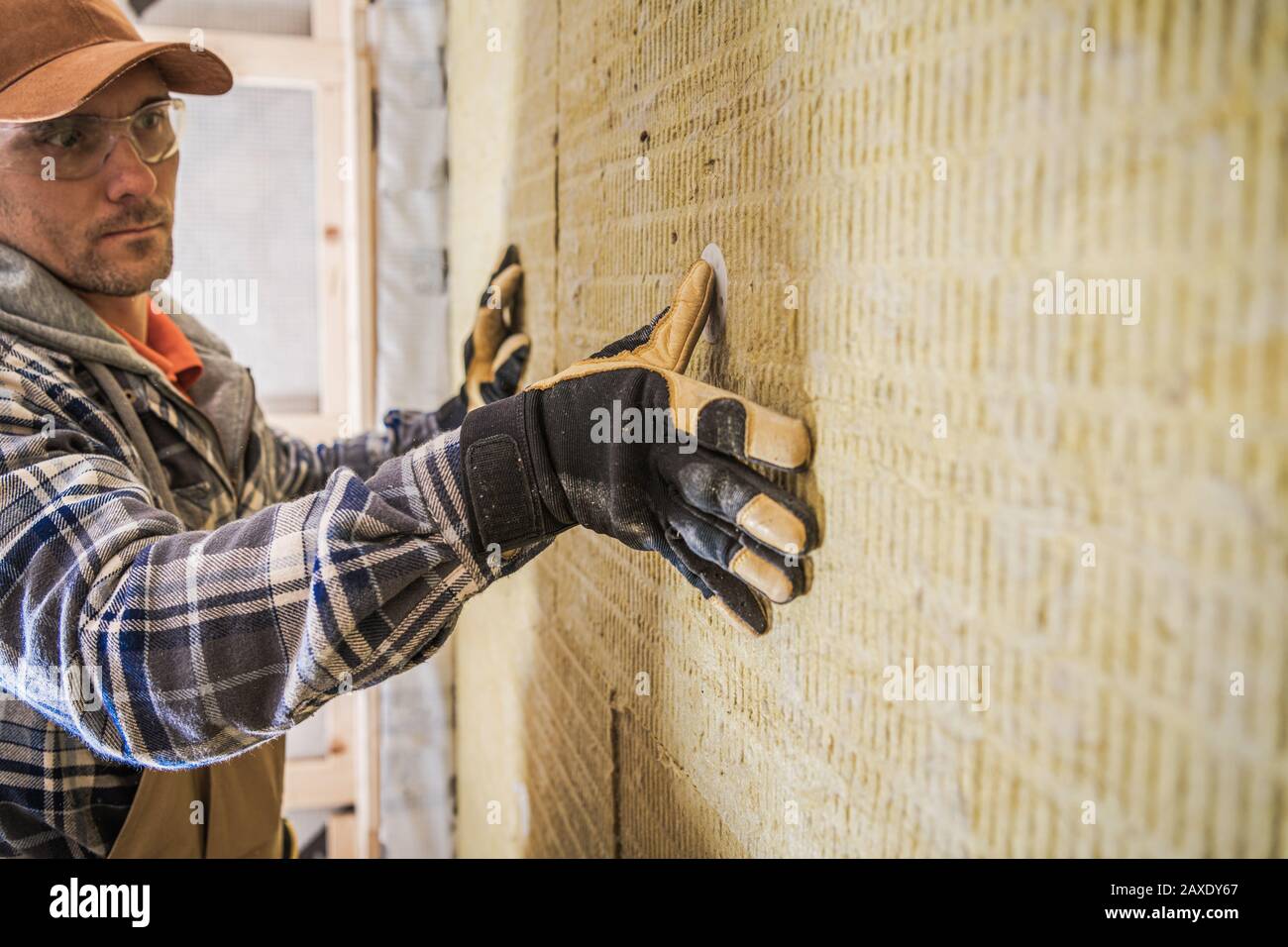 Construction Contractor Worker Finishing Mineral Wool Insulation ... Construction Contractor Worker Finishing Mineral Wool Insulation ...