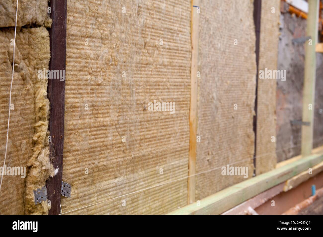 warming the walls of a stone house with a stone wool heater. Ecological ...