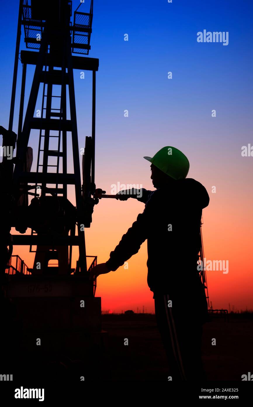 oil field, the oil workers are working Stock Photo - Alamy