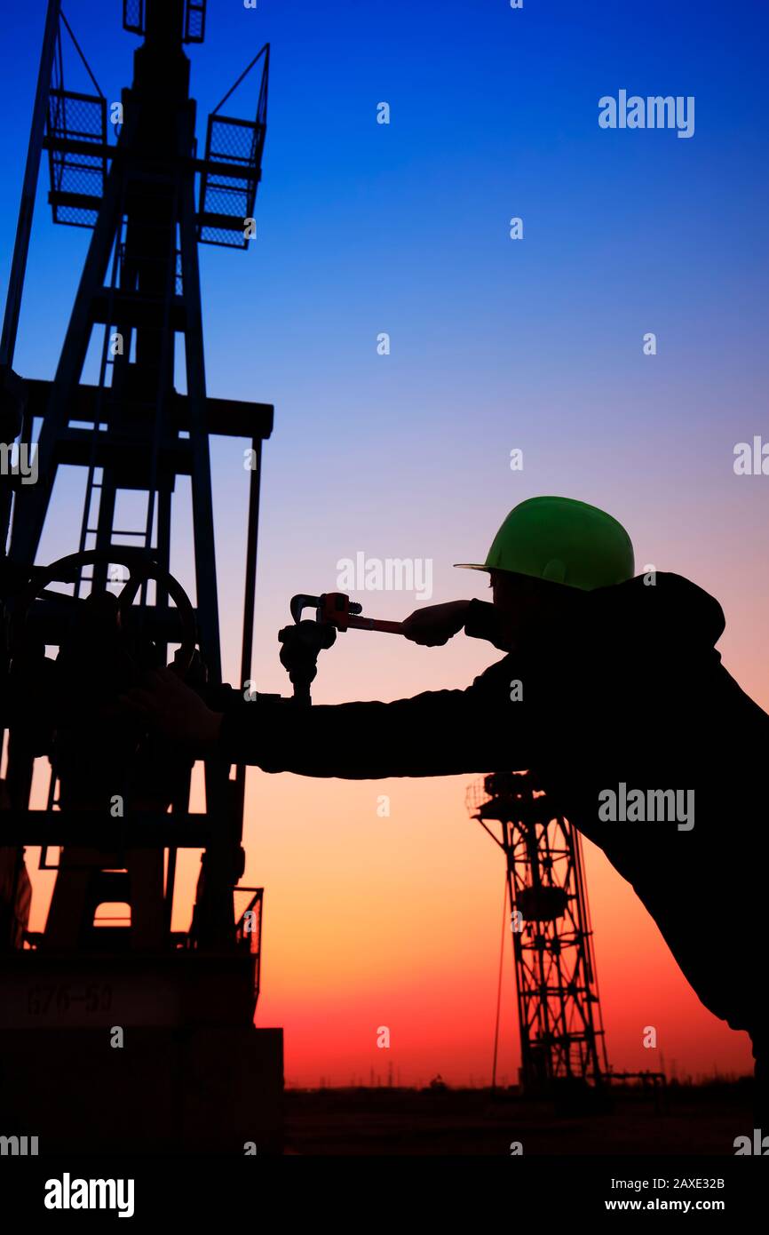 oil field, the oil workers are working Stock Photo - Alamy