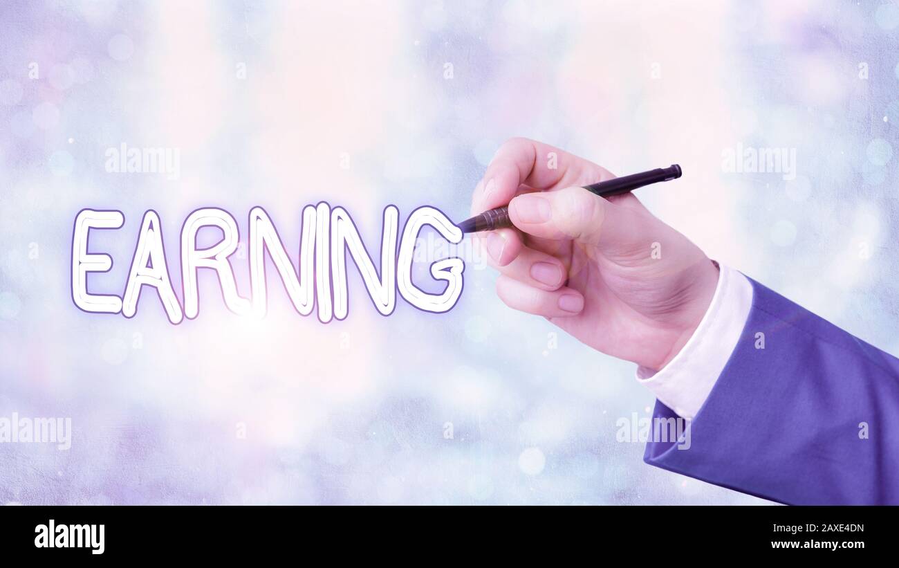 Writing note showing Earning. Business concept for something earned as ...