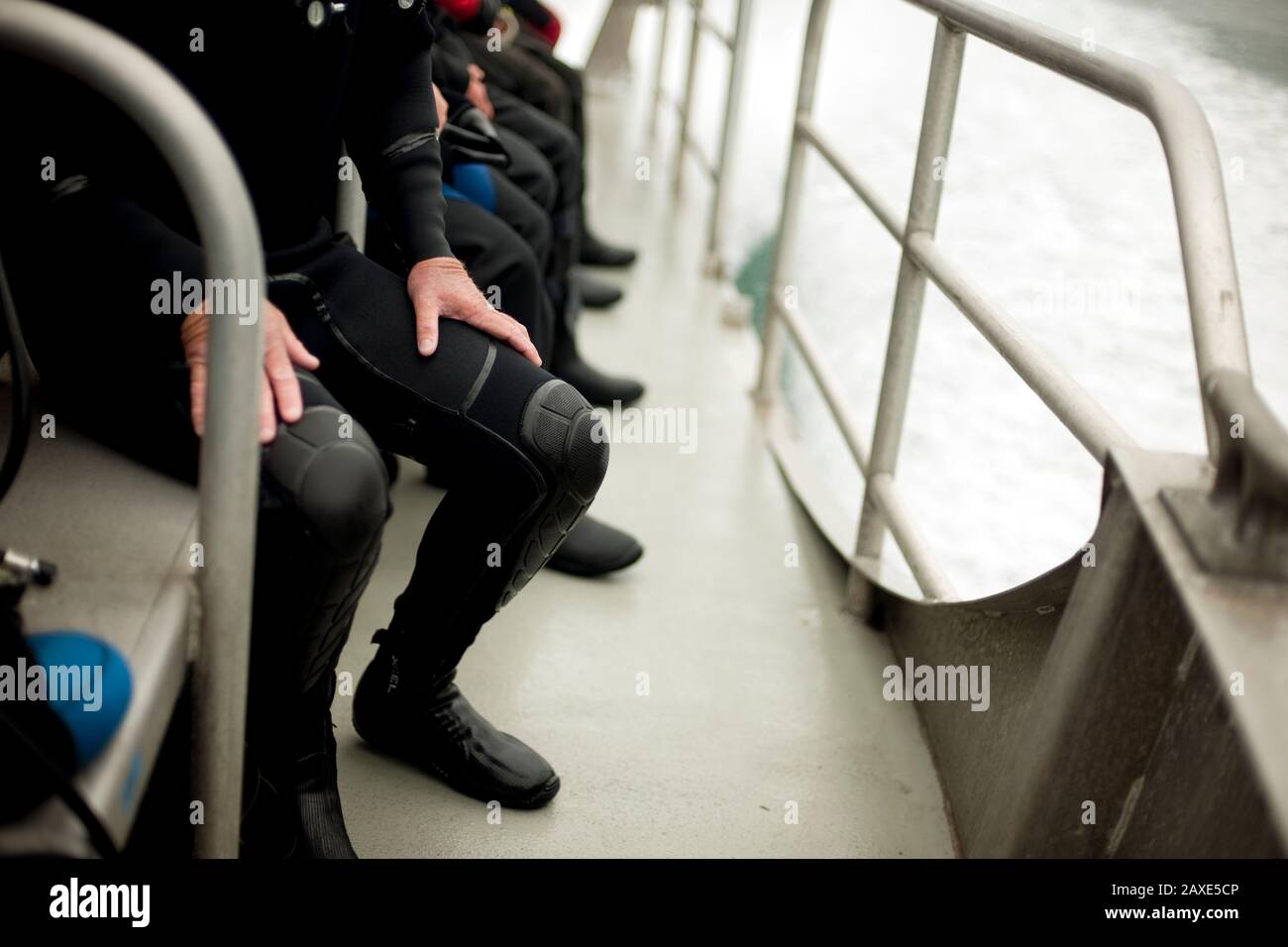 Low section view of a scuba diver's legs sitting on a boat Stock Photo ...