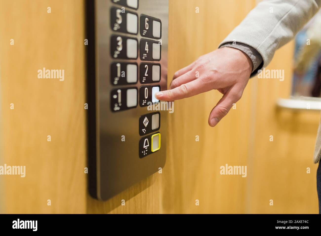 Forefinger pressing zero floor button in the elevator Stock Photo - Alamy