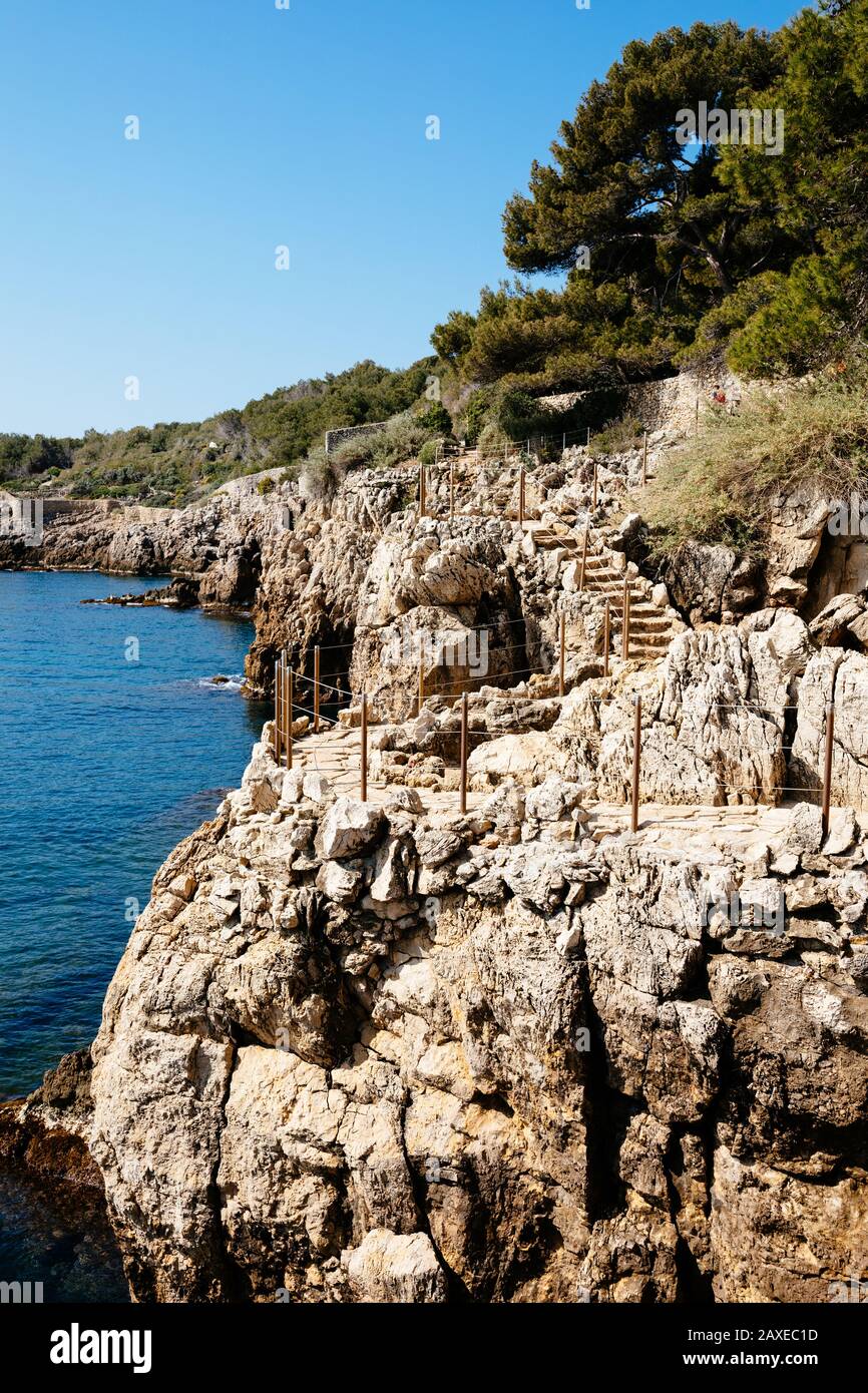 Antibes hike in the Cap d'Antibes bay with coastal cliffs, French ...