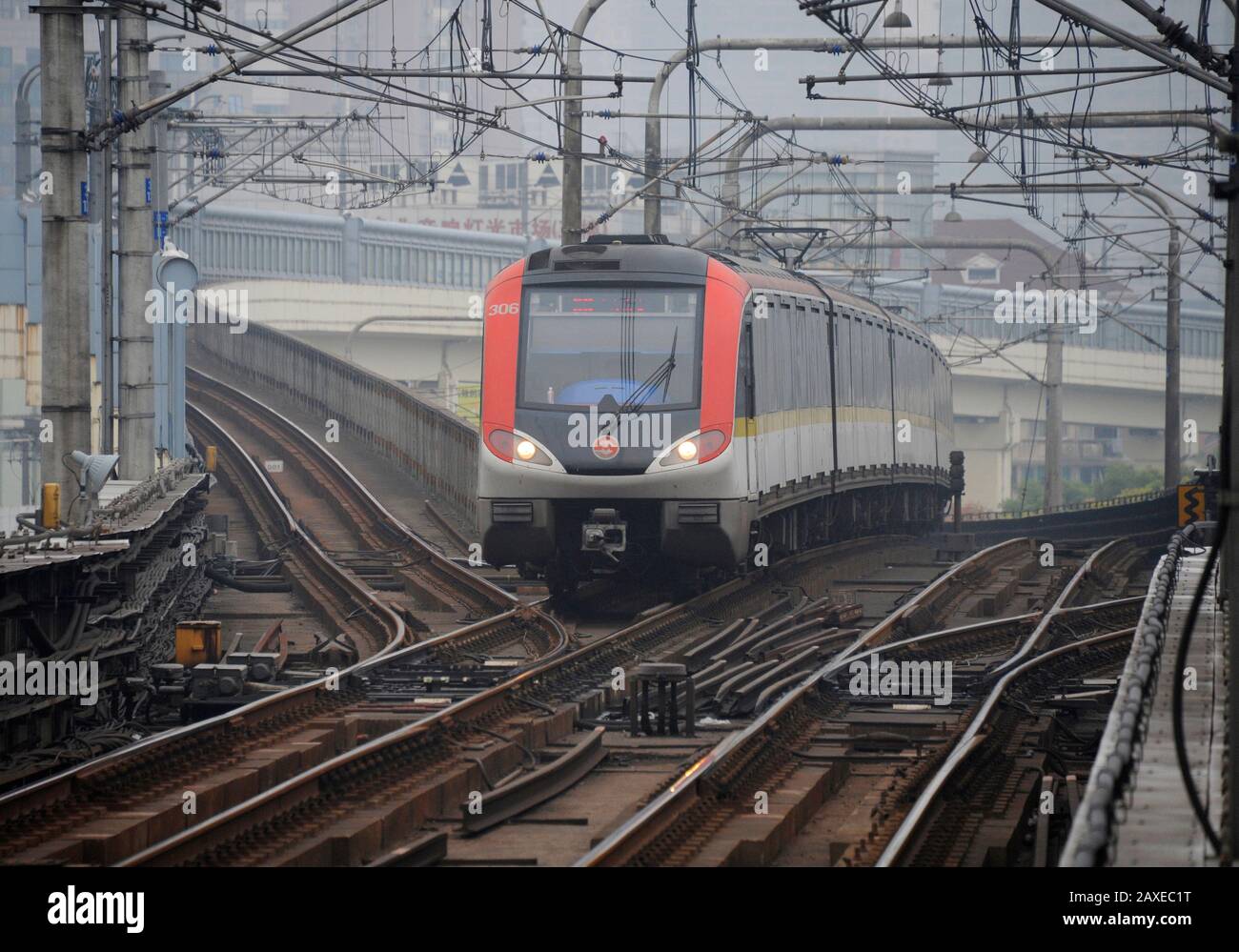 Shanghai metro line 3 train approaches Baoshan road station, Shanghai ...
