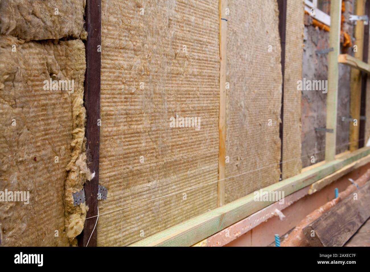 warming the walls of a stone house with a stone wool heater. Ecological ...