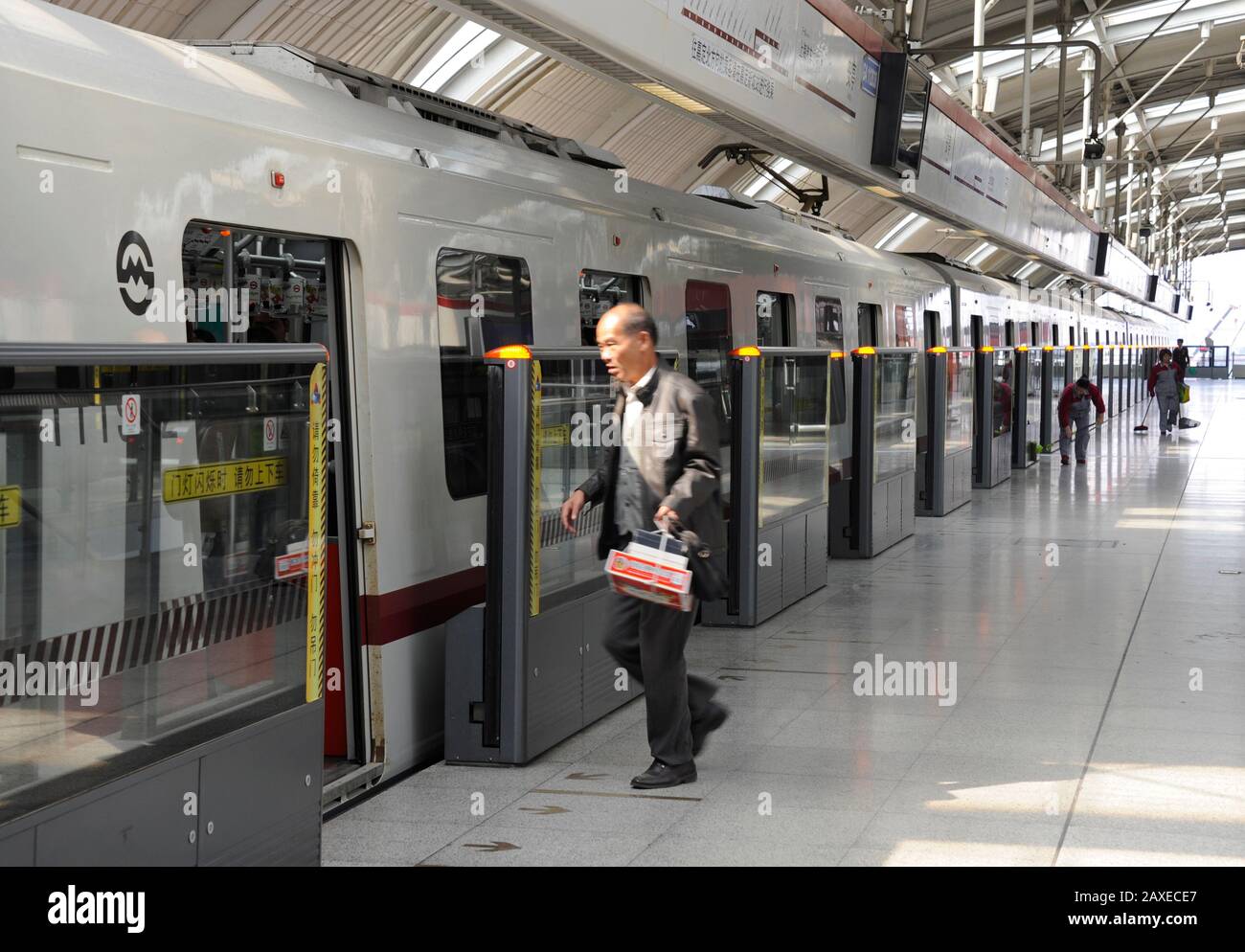 Man boards a Shanghai metro line 11 train at Anting station, Shanghai ...