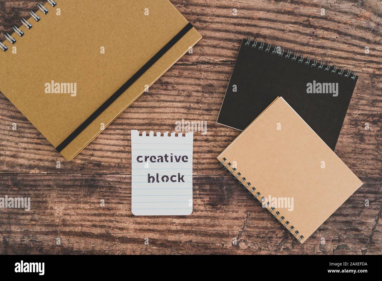 creative block or writer's block conceptual still-life, notepads on ...