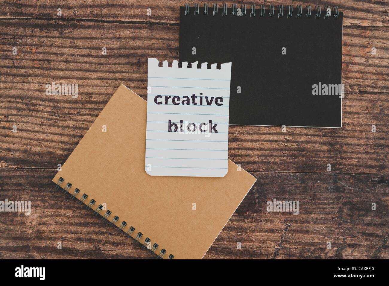 creative block or writer's block conceptual still-life, notepads on ...