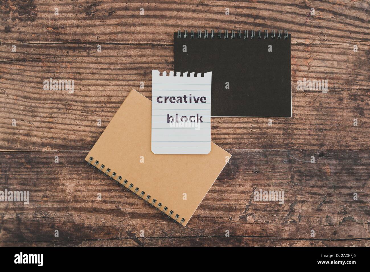creative block or writer's block conceptual still-life, notepads on ...