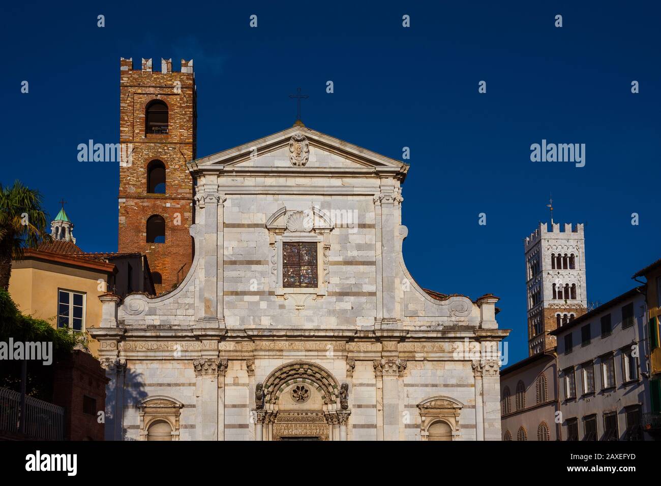 Old medieval churches in Lucca historic center with ancient bell towers ...