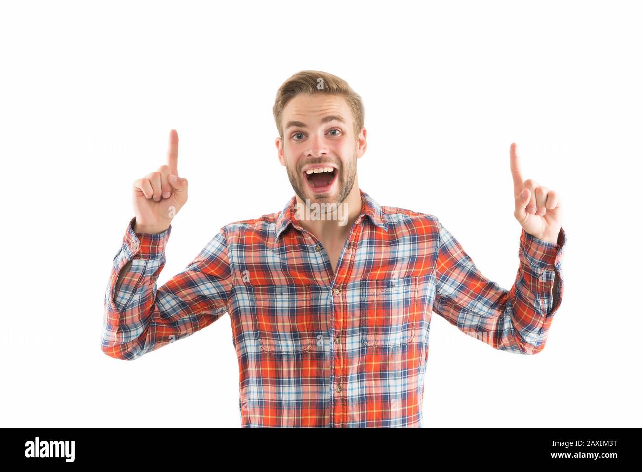 Check it out. Look there. Man pointing at copy space. Man muscular ...