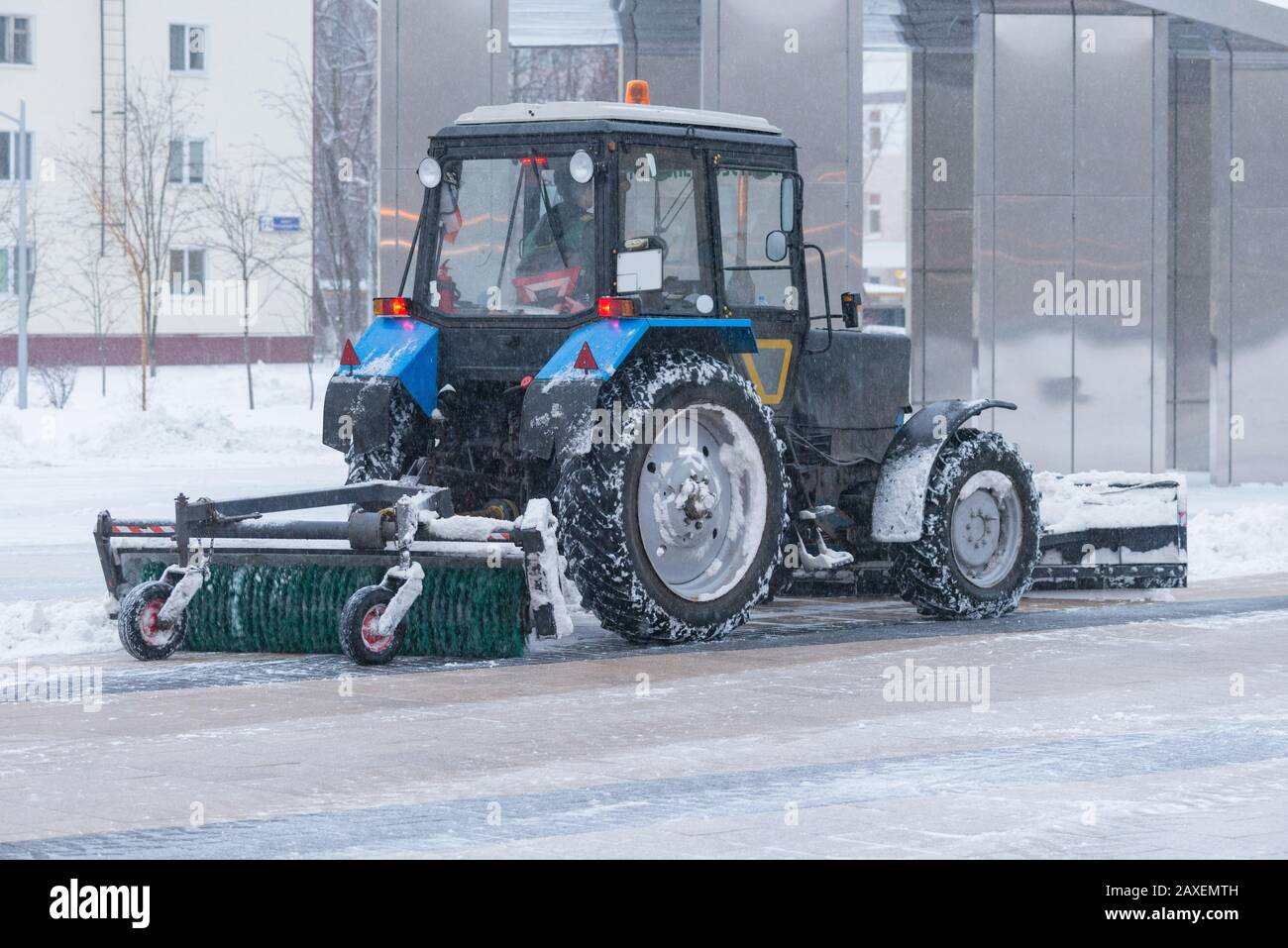 Working snow cleaner on the street at winter time Stock Photo - Alamy