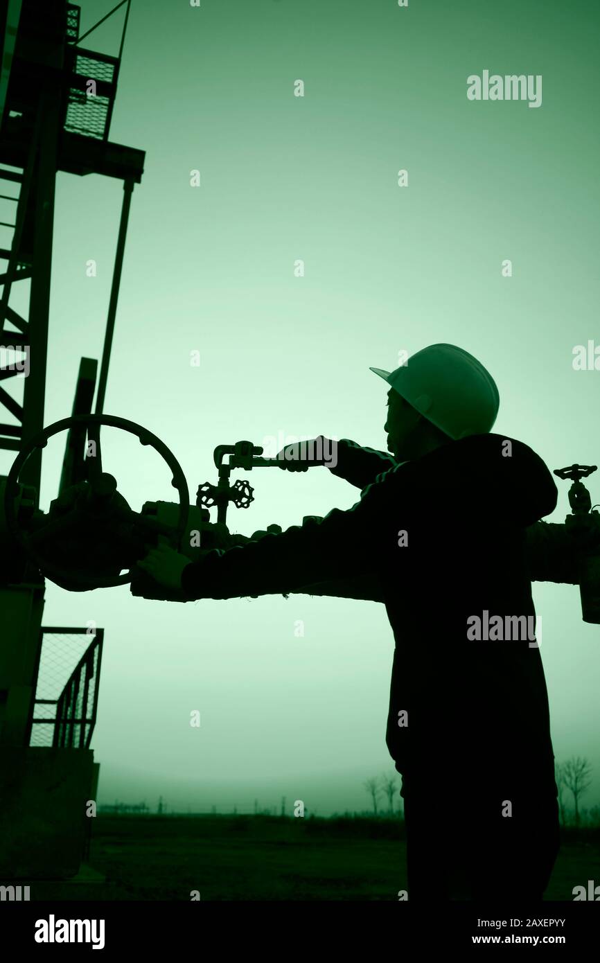 oil field, the oil workers are working Stock Photo - Alamy