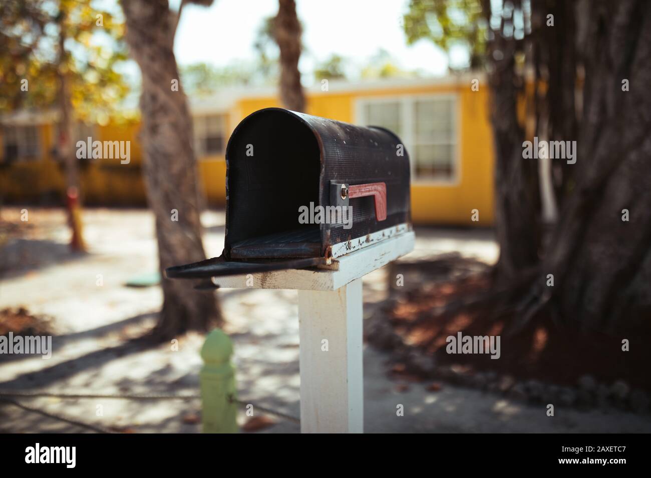 Mail box on Sanibel Island, Retro post box in front of a yellow house ...