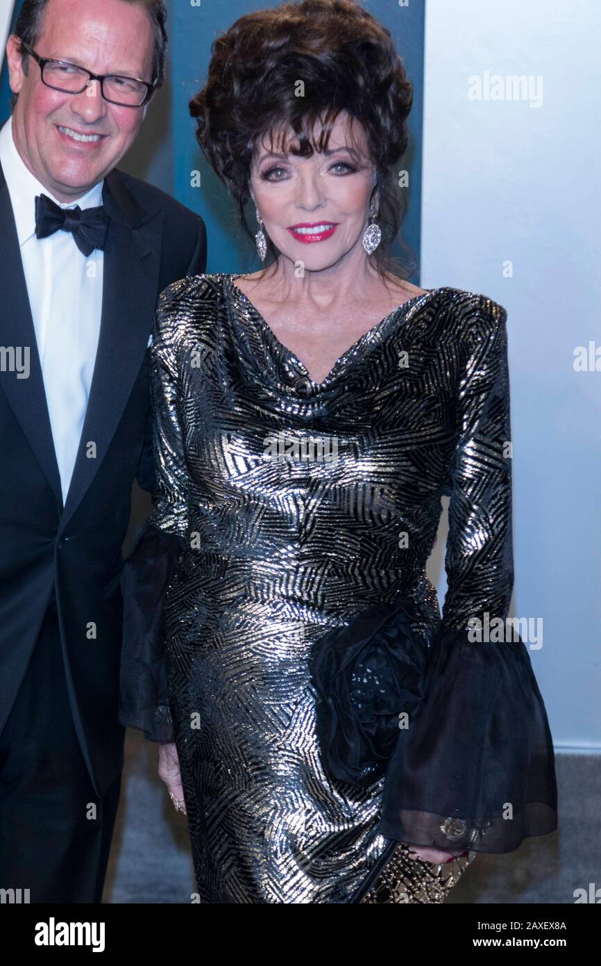 Percy Gibson and Joan Collins attend the Vanity Fair Oscar Party at ...