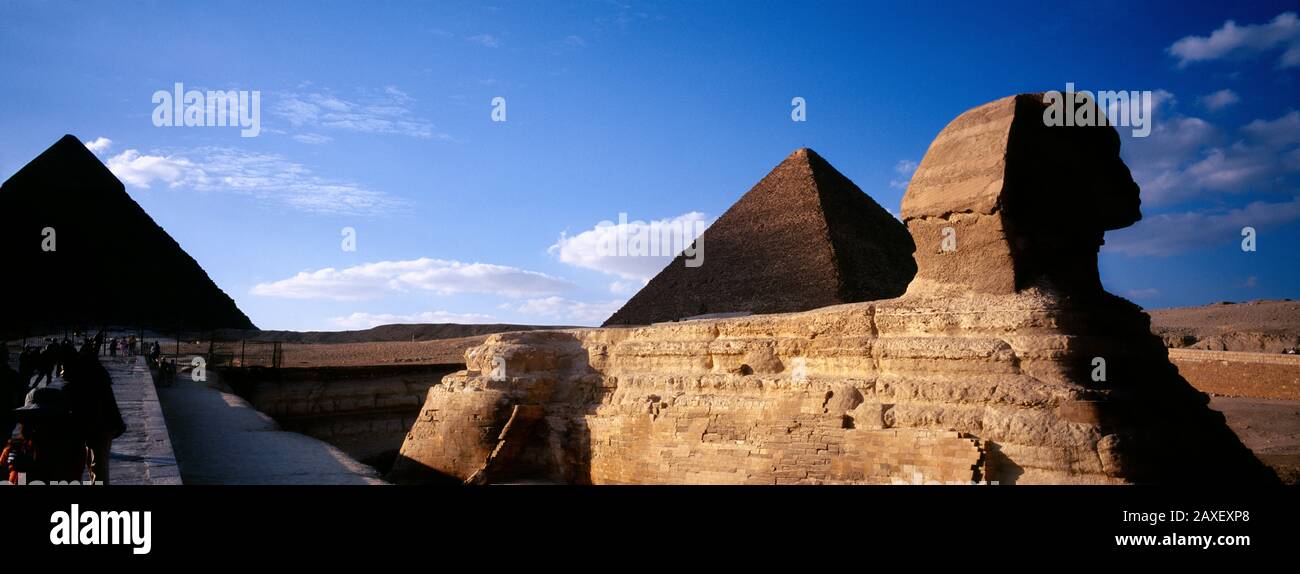 Sphinx in front of a pyramid, Great Pyramid, Giza, Cairo, Egypt Stock ...