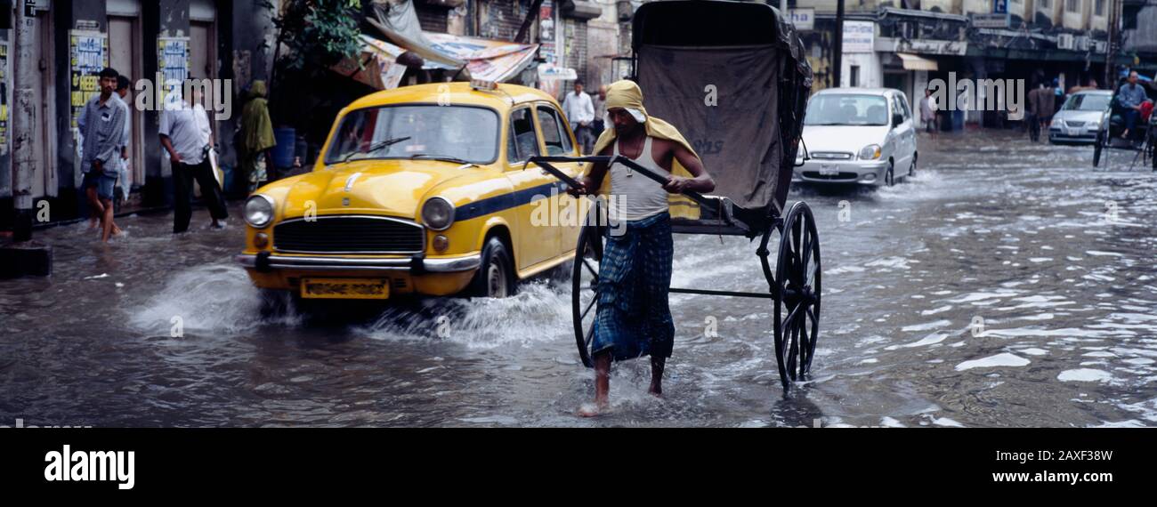 Cars and a rickshaw on the street, Calcutta, West Bengal, India Stock ...