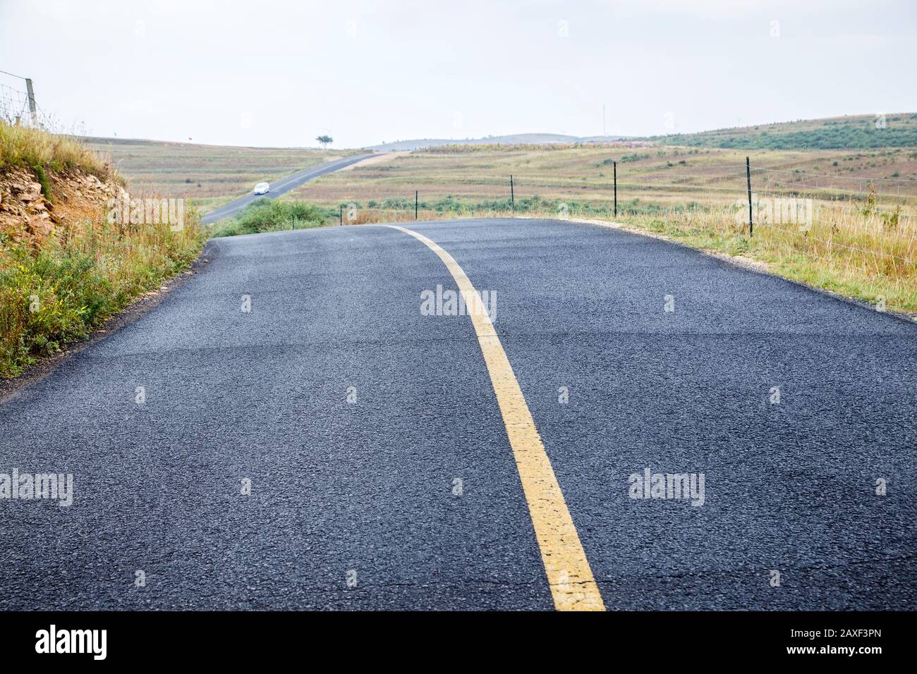 asphalt road on grassland Stock Photo - Alamy