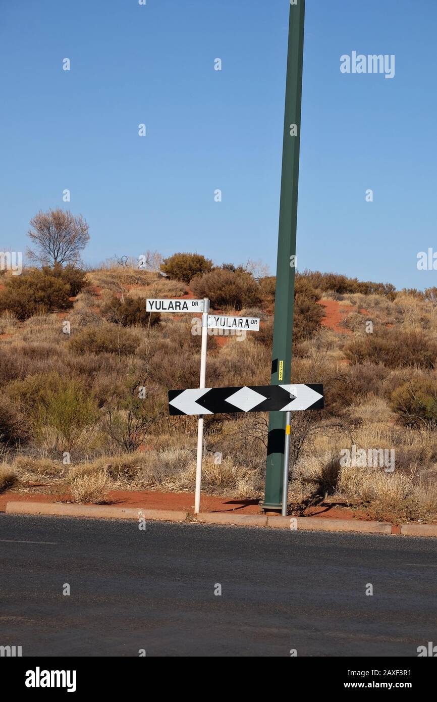 Road signs desert grasses Yulara desert resort in the Northern ...