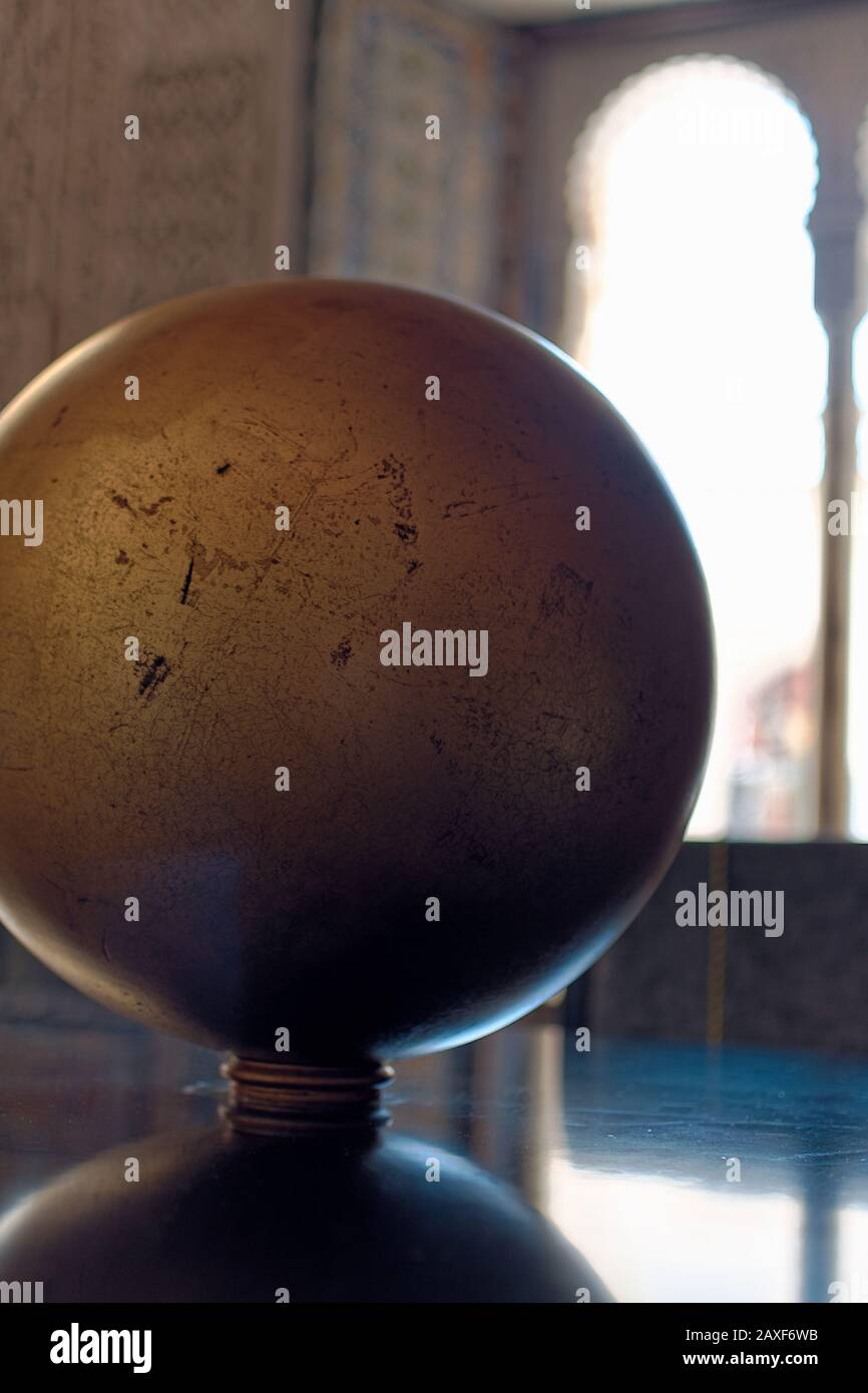 Vertical shot of a ball inside of a building with long columns Stock ...
