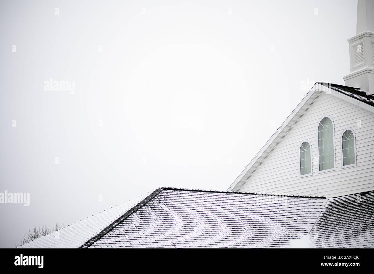 Low angle shot of a church with a staple under the bright sky Stock ...