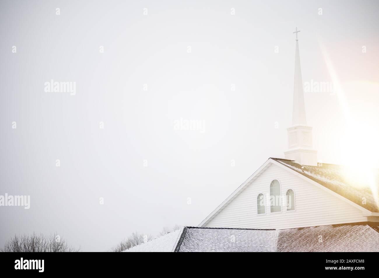 Low angle shot of a church with a staple under the bright sky Stock ...