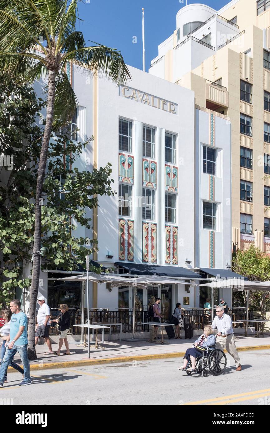 People walk by the Art Deco Cavalier Hotel on Ocean Drive in Miami ...