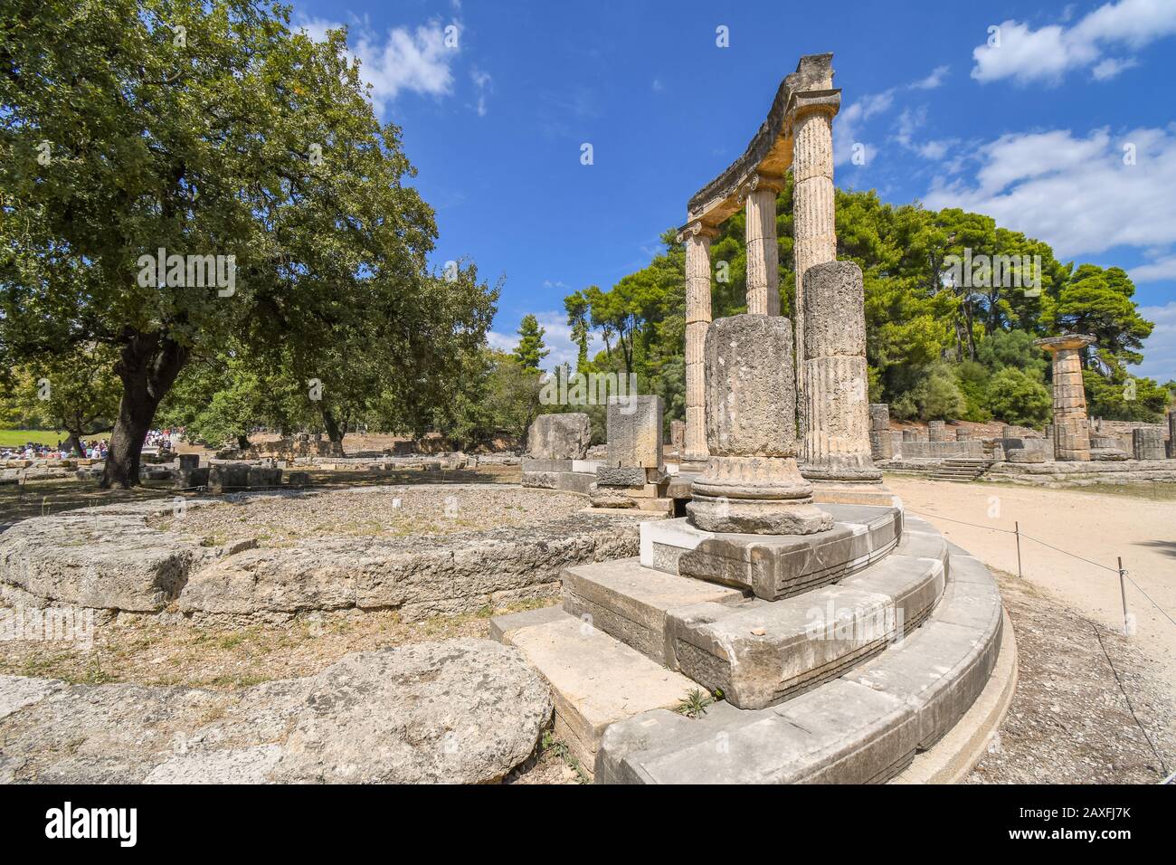 Tourists visit the ancient Philippeion in the Altis of Olympia, an ...