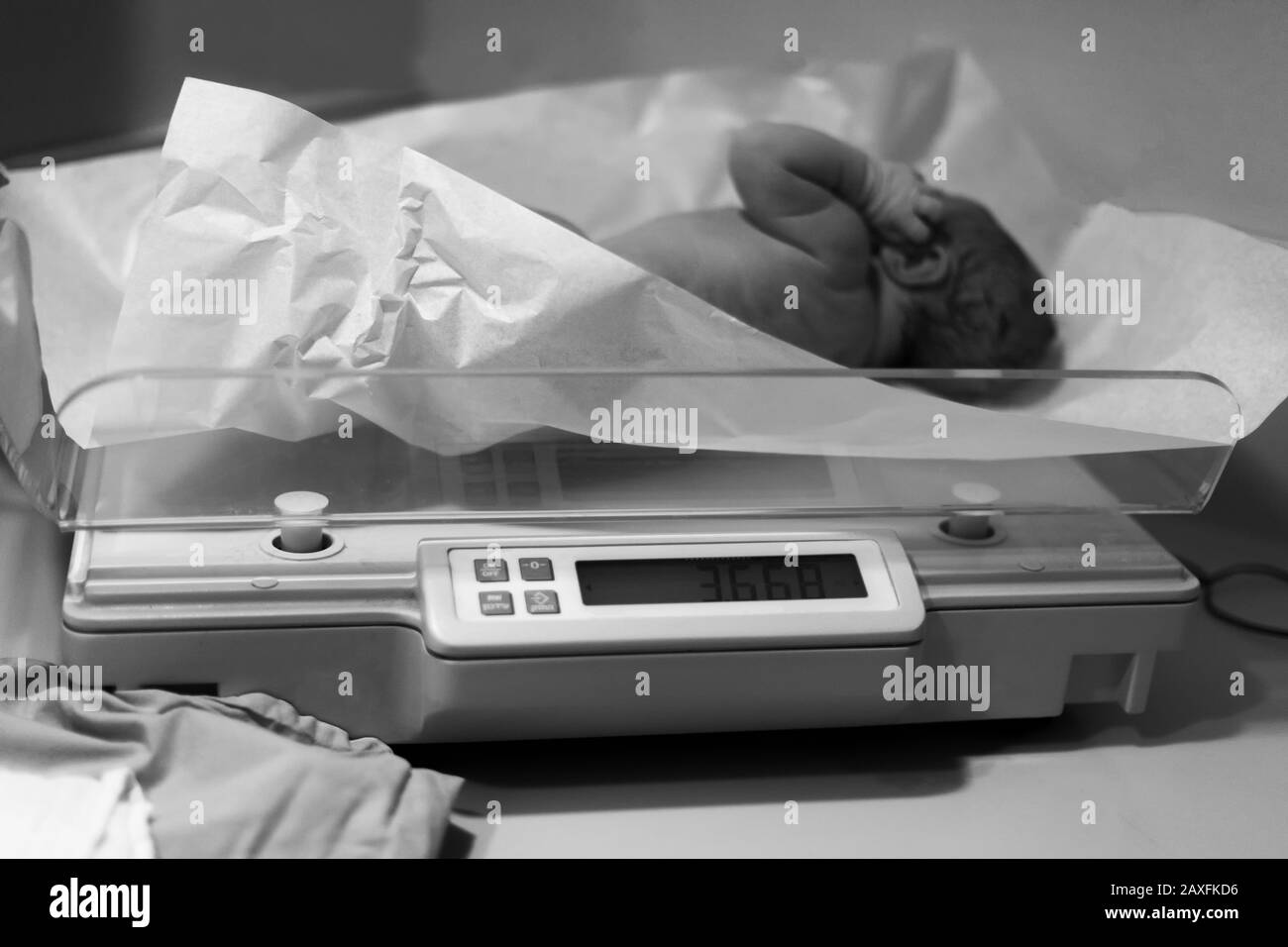 Baby weighing scales Black and White Stock Photos & Images - Alamy