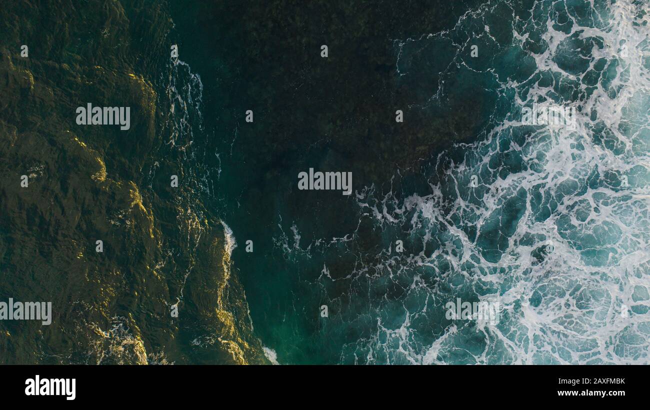 Ocean water from above with the left side of the image capturing the ...