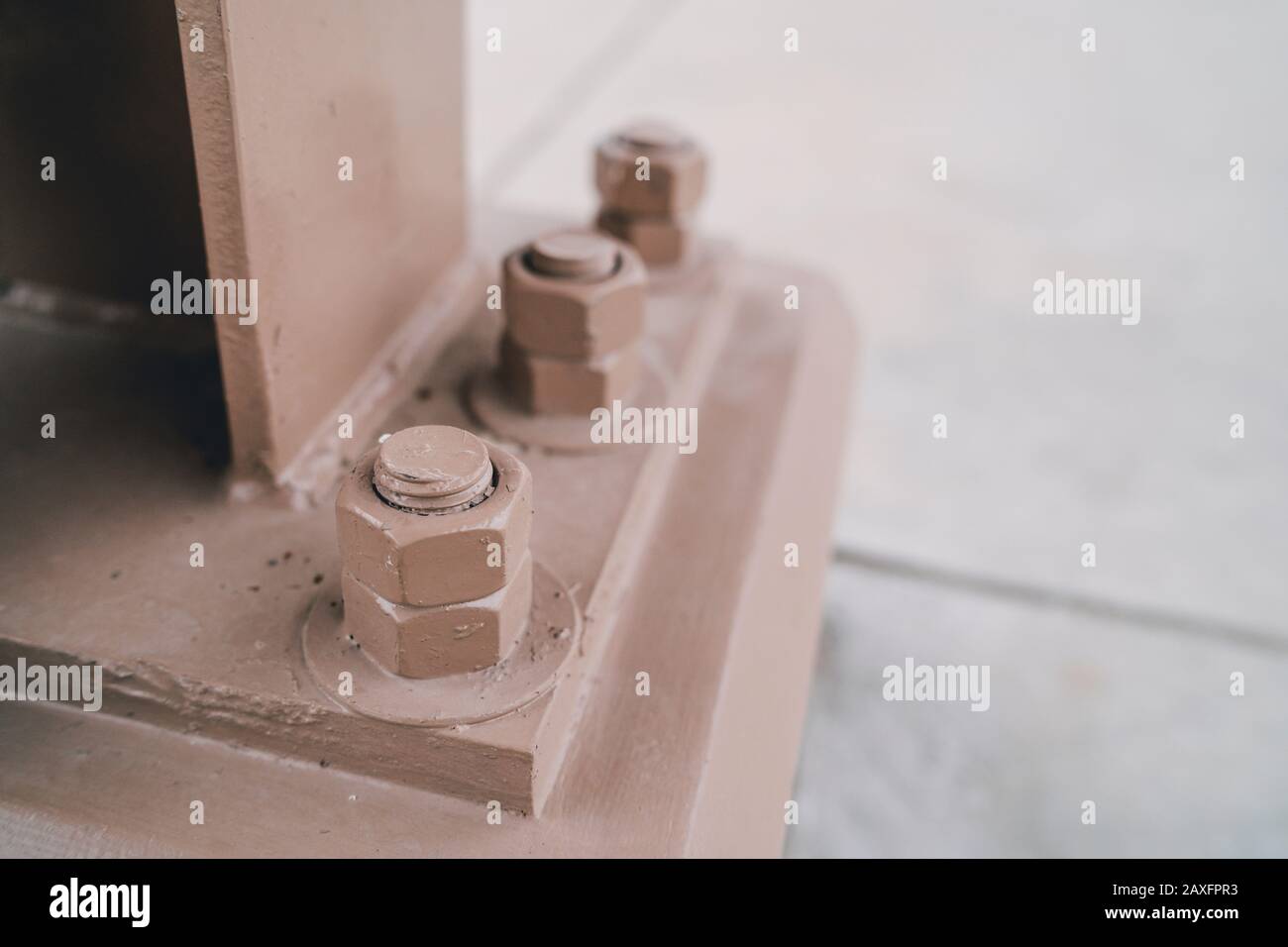 Big nut and screw tighted Stock Photo - Alamy