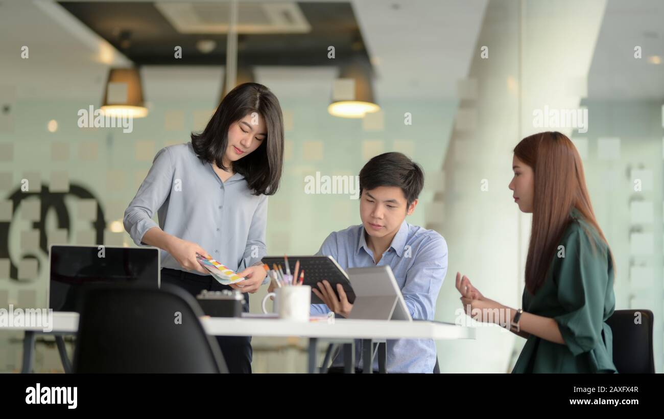 Young professional UI graphic designer group working on their project ...