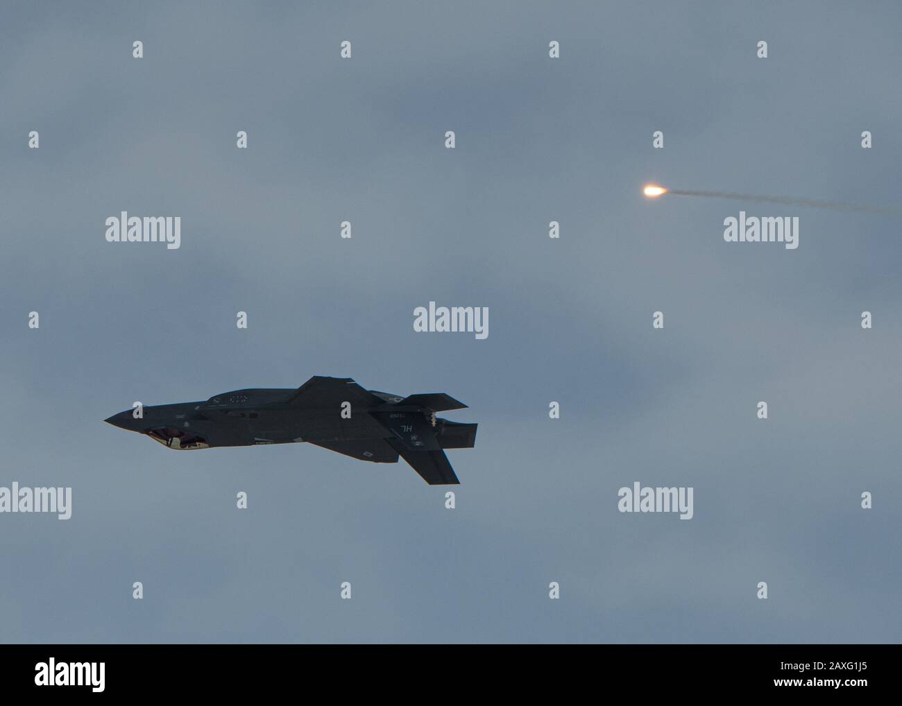 An F-35A Lightning II releases a flare while inverted over Hill Air ...