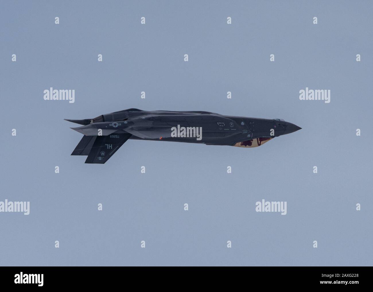 An F-35A Lightning II flies inverted over Hill Air Force Base during a ...