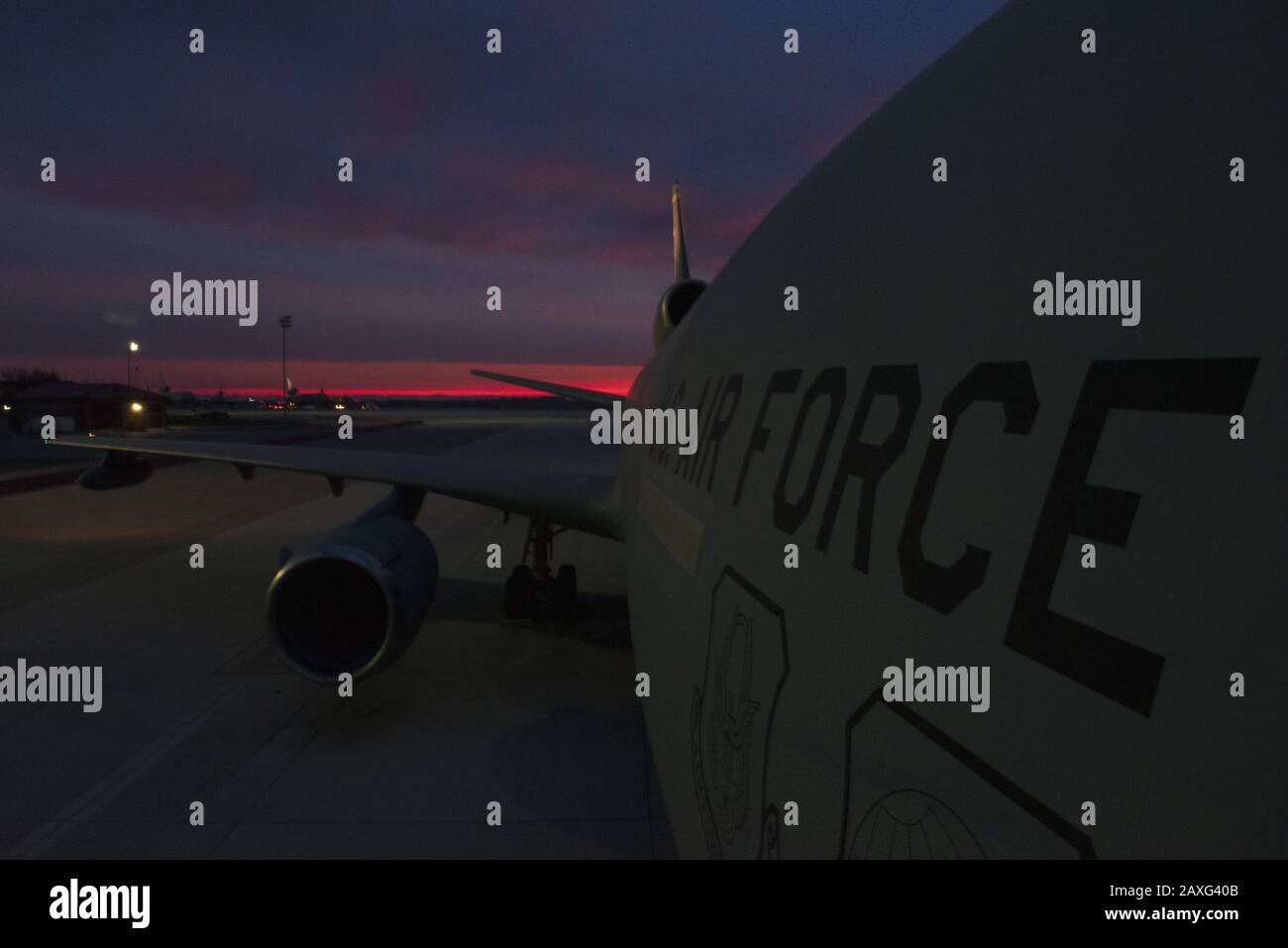 The sun rises behind a KC-10 Extender Dec. 17, 2019, at Travis Air ...