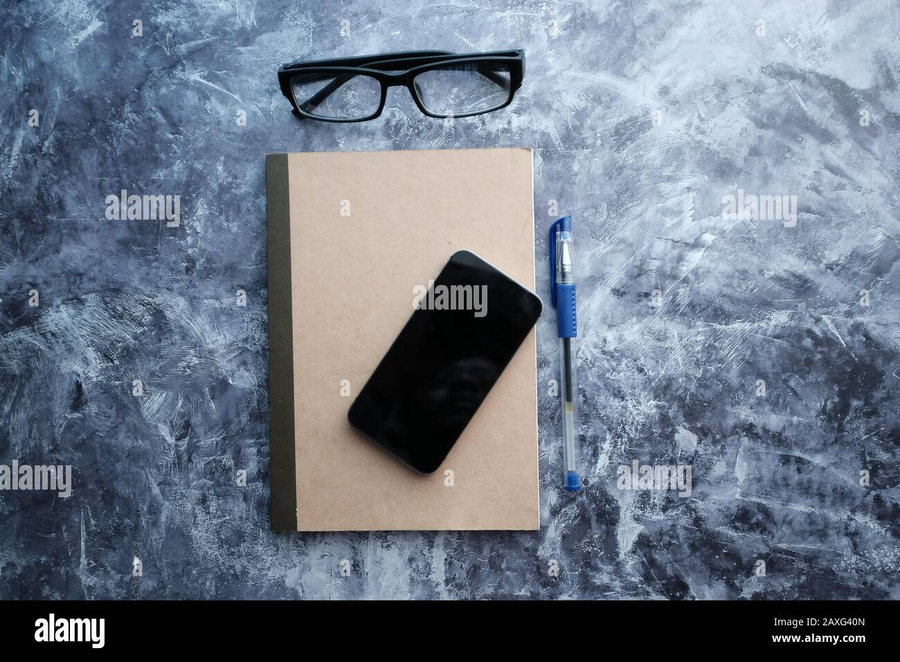 top view of smart phone , notepad and eyeglass Stock Photo - Alamy