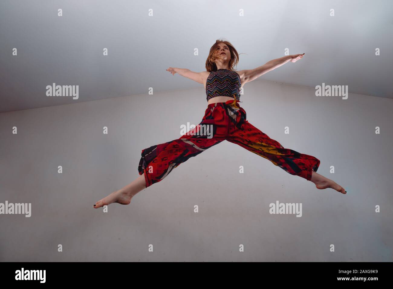 Slender flexible dance performer during a dance practice Stock Photo ...