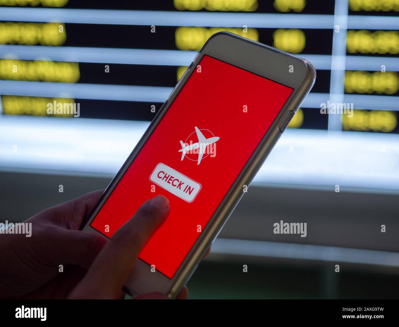 Flight check-in by mobile phone. Hand touching on smartphone screen to ...