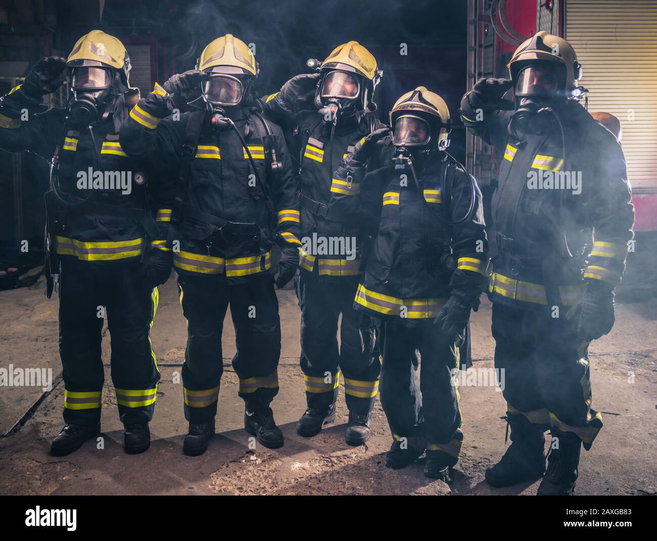 Team of fireman standing the middle of the fire extinguisher's smoke ...
