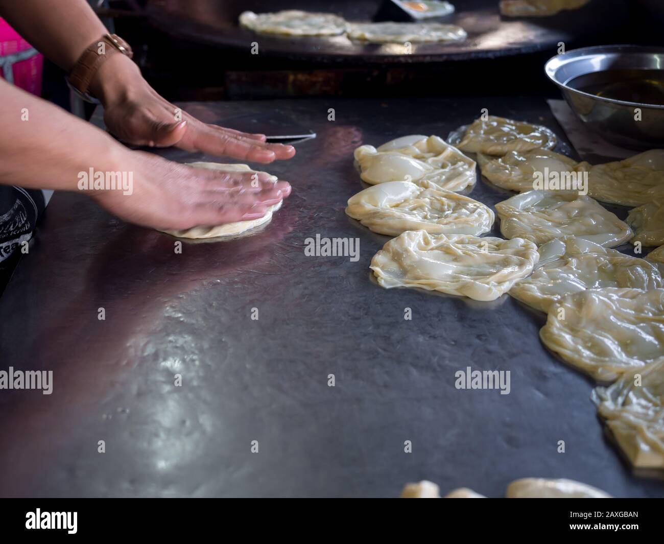 Roti Making, roti thresh flour by roti maker with oil. Indian ...