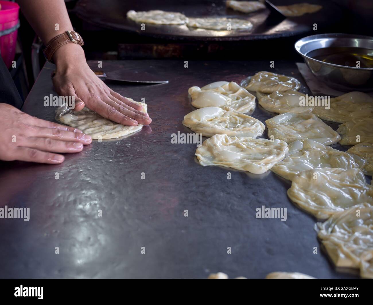 Roti Making, roti thresh flour by roti maker with oil. Indian ...