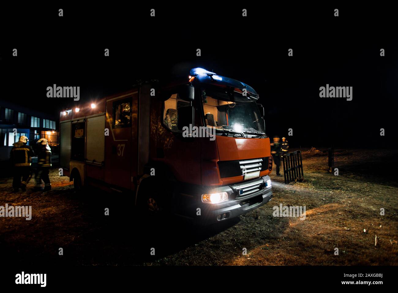 Fire truck with flashing lights during a firefighting operation Stock ...
