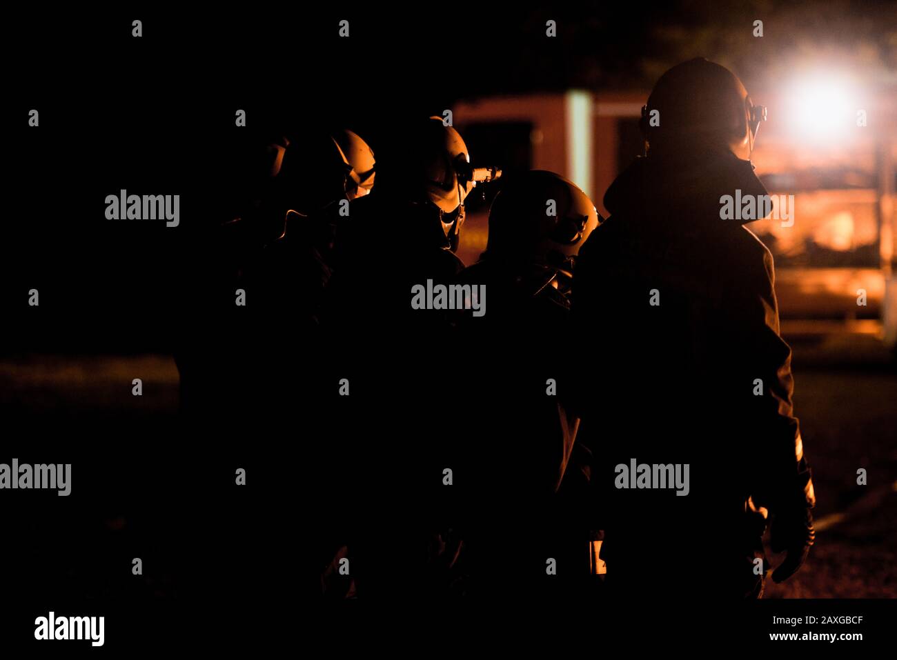 Fire brigade during operation in the field at night time Stock Photo ...