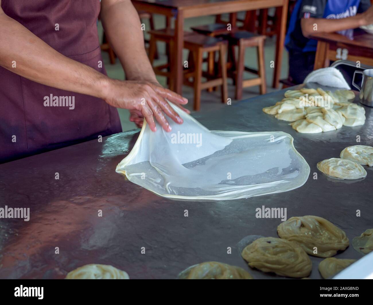 Roti Making, roti thresh flour by roti maker with oil. Indian ...