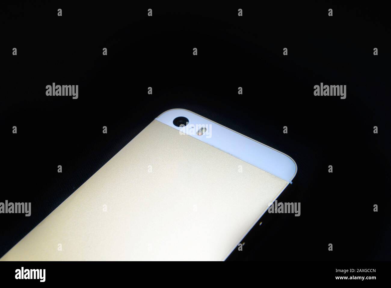 Close-up of the back of a mobile phone against a black background Stock ...