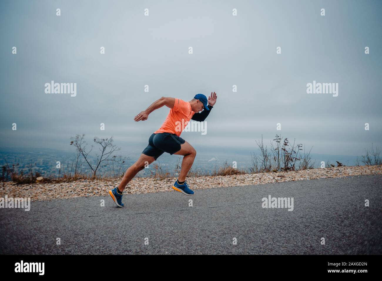 Mature man over 40 wearing sport clothes during a sprint exercise Stock ...