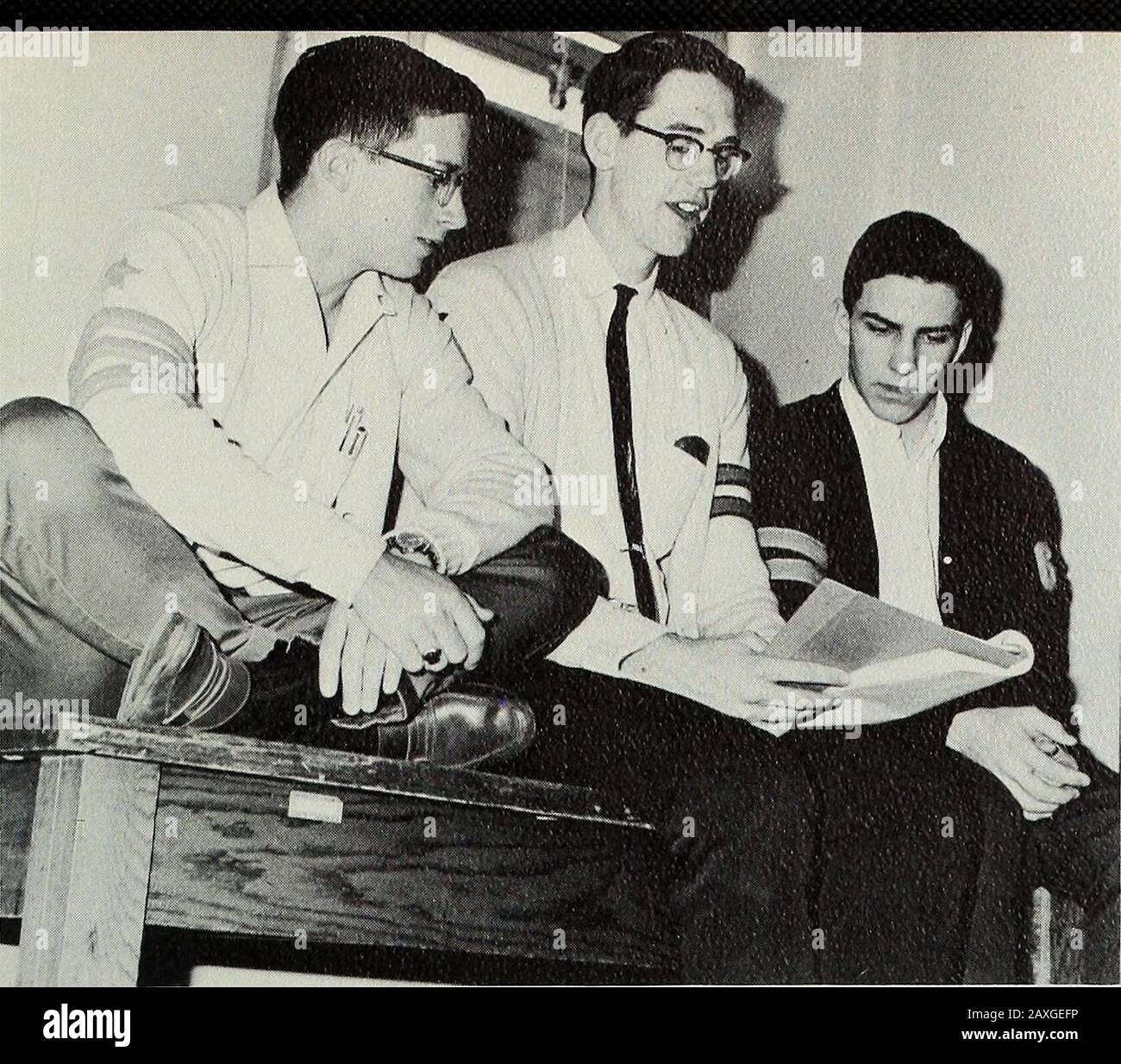 U and I . U-Club officers conduct an informal board meeting: Dave ...