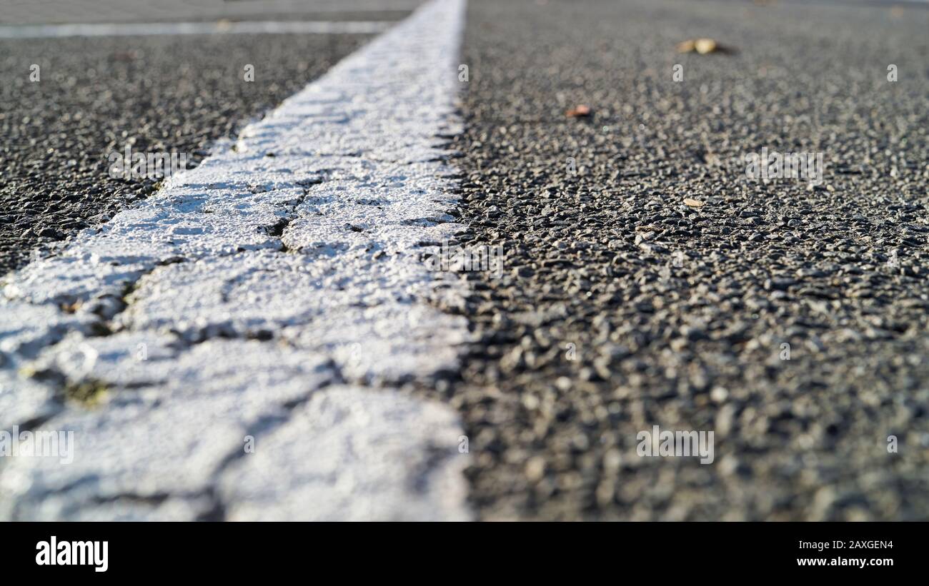 White marking on asphalt hi-res stock photography and images - Alamy
