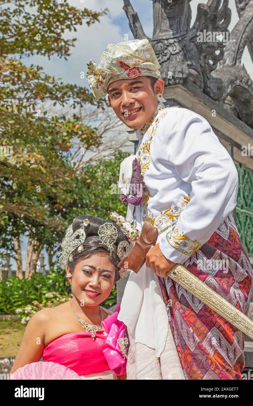 A Balinese wedding couple photographed in the Tirtagangga Water Palace ...
